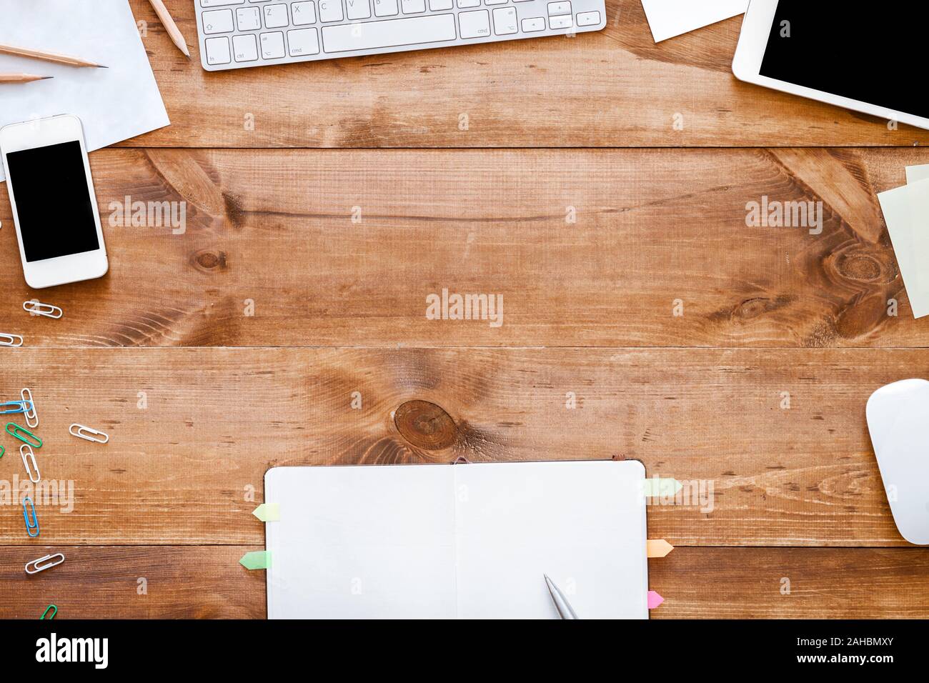 Business work table with devices and open notebook, top view Stock ...