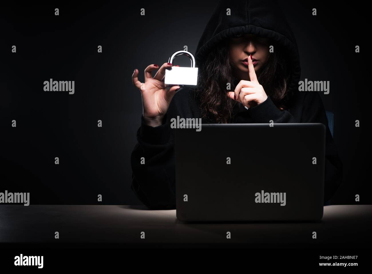 The female hacker hacking security firewall late in office Stock Photo ...