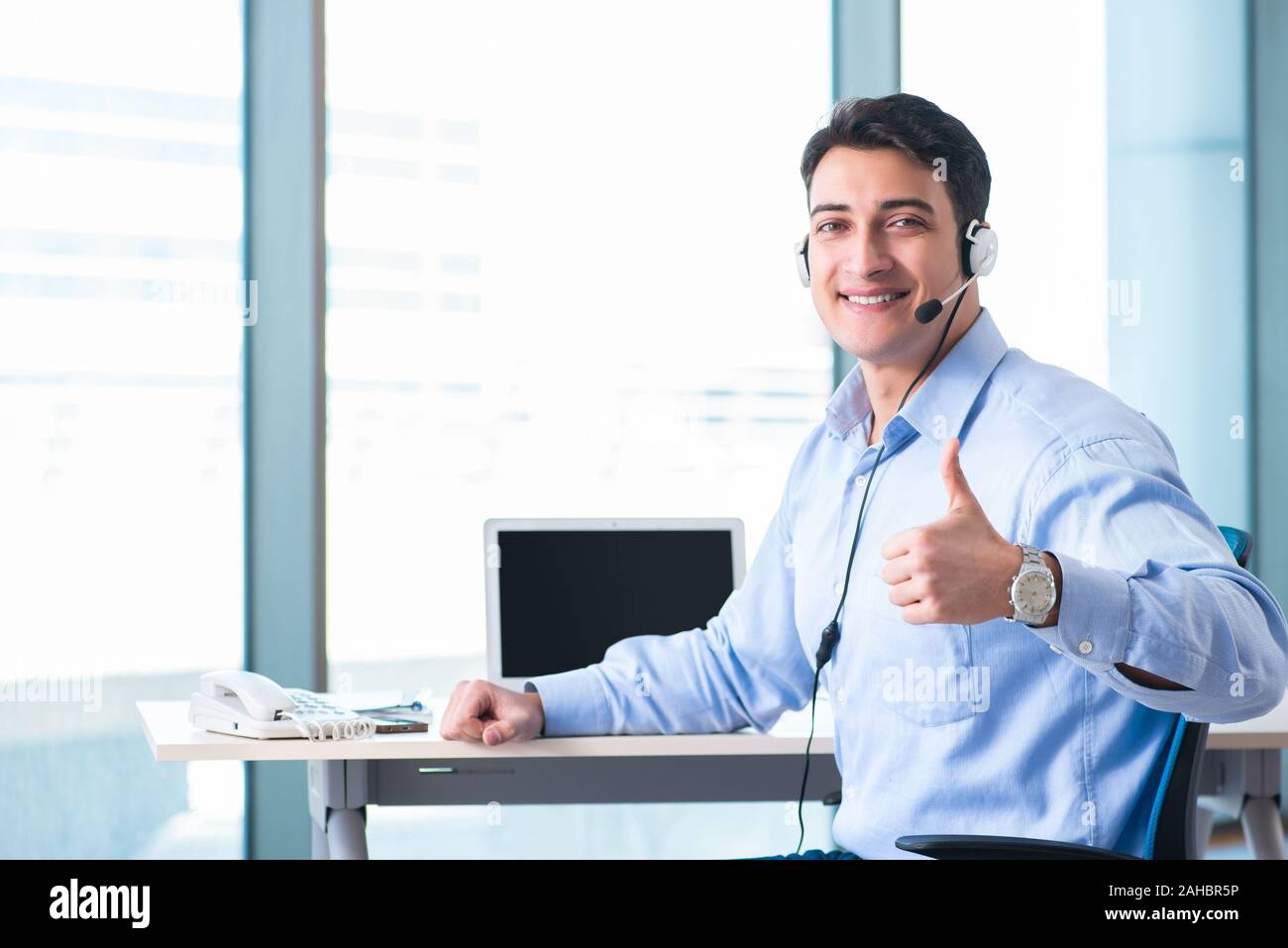 Call center giving thumbs up hi-res stock photography and images - Alamy