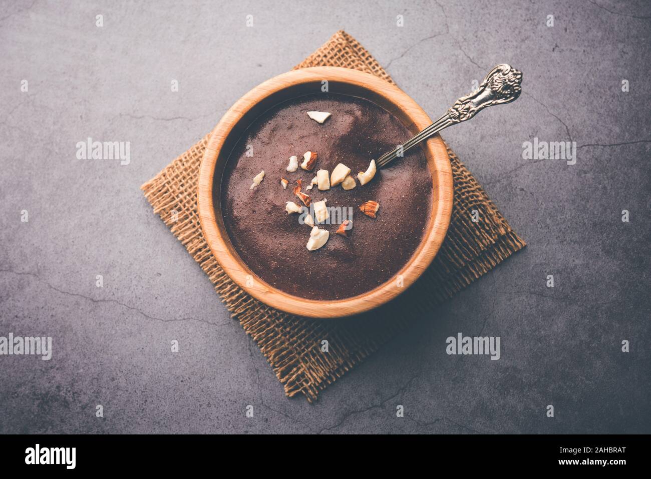 Sweet Ragi Malt / Healthy Ragi Porridge in a bowl garnished with ...