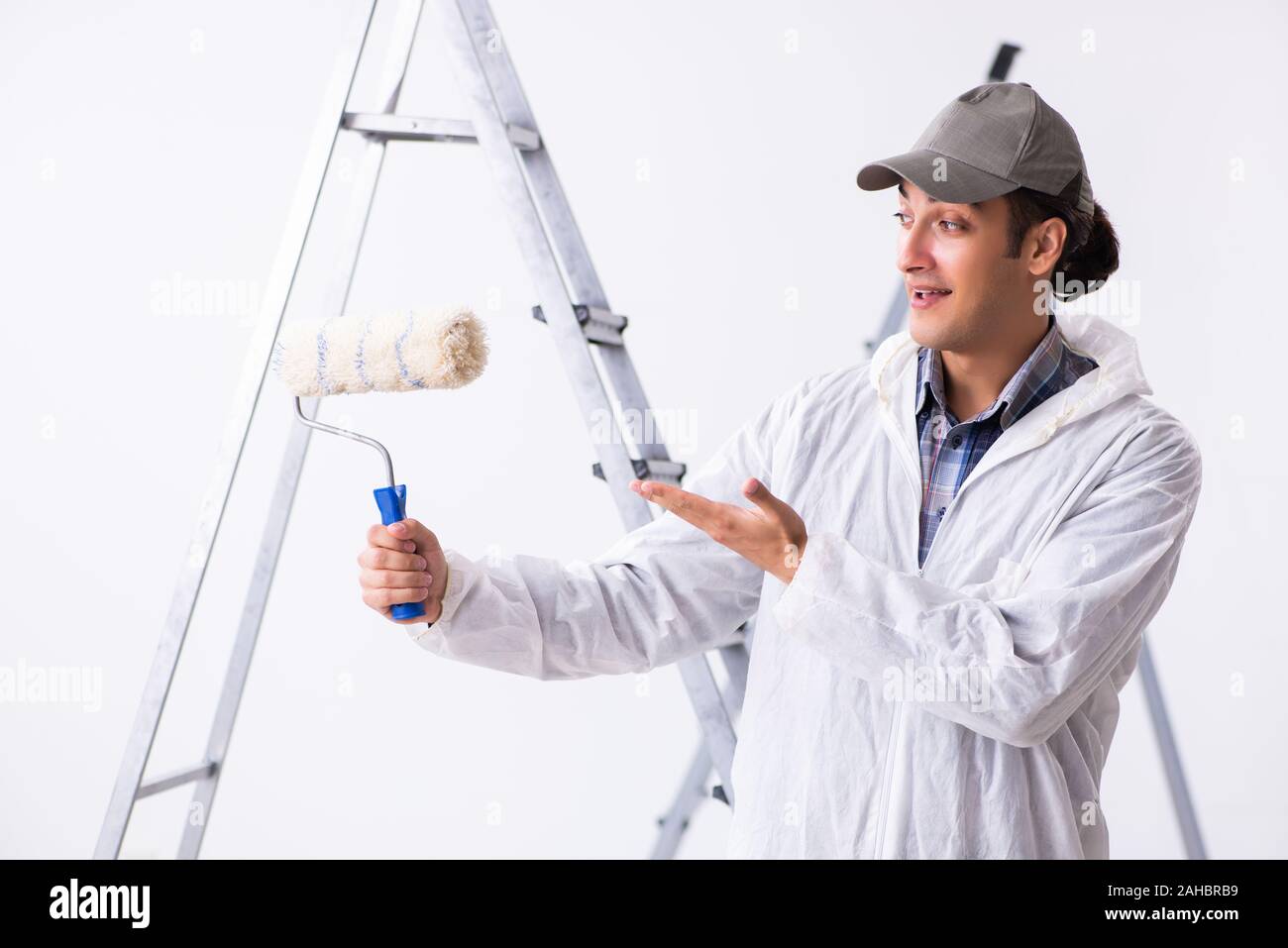 Painter working at the construction site Stock Photo - Alamy