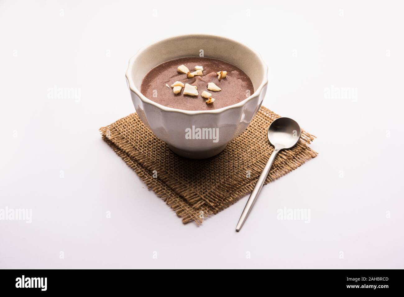 Sweet Ragi Malt / Healthy Ragi Porridge in a bowl garnished with ...