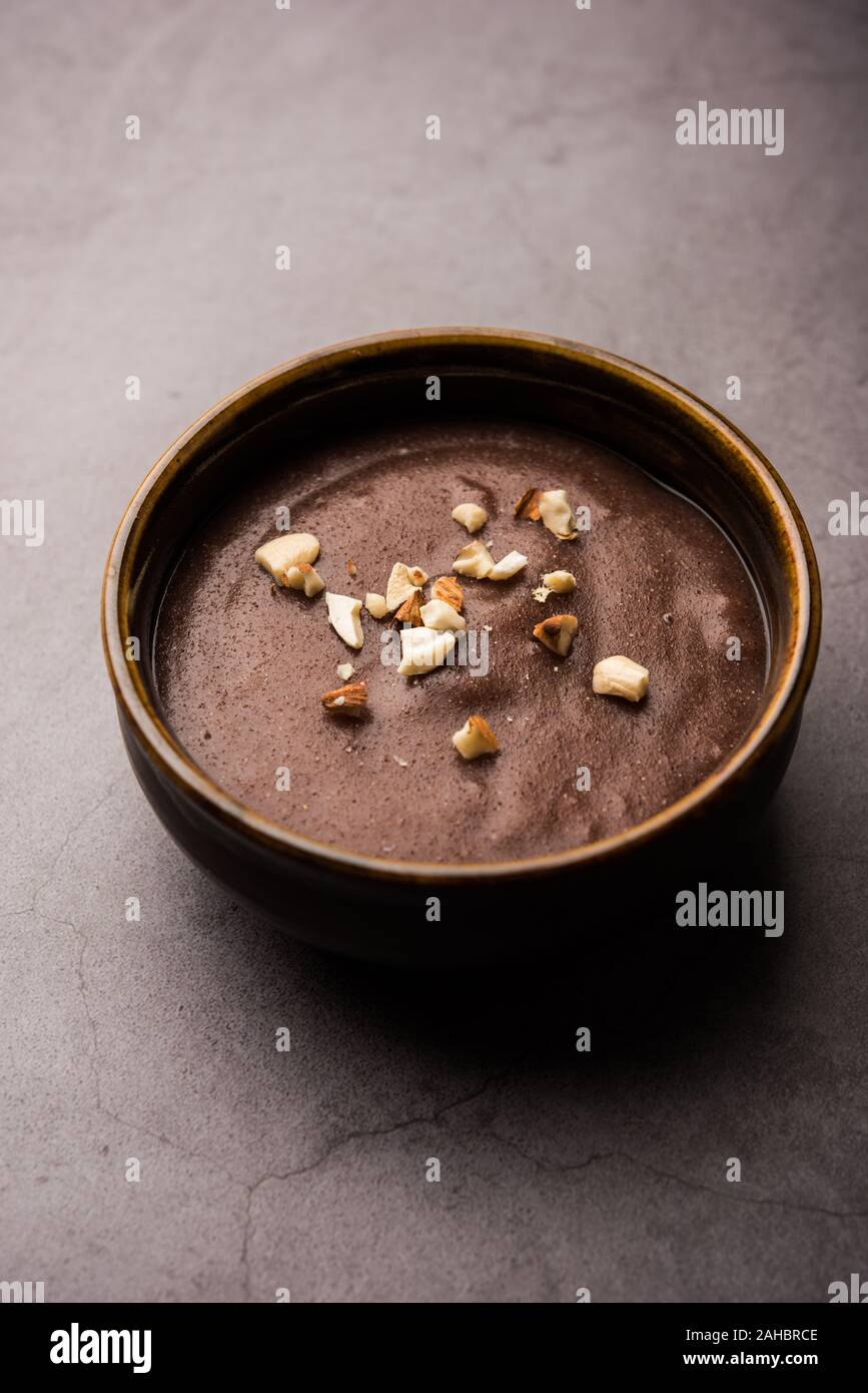 Sweet Ragi Malt / Healthy Ragi Porridge in a bowl garnished with ...