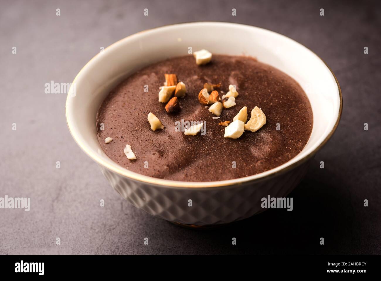 Sweet Ragi Malt / Healthy Ragi Porridge in a bowl garnished with ...