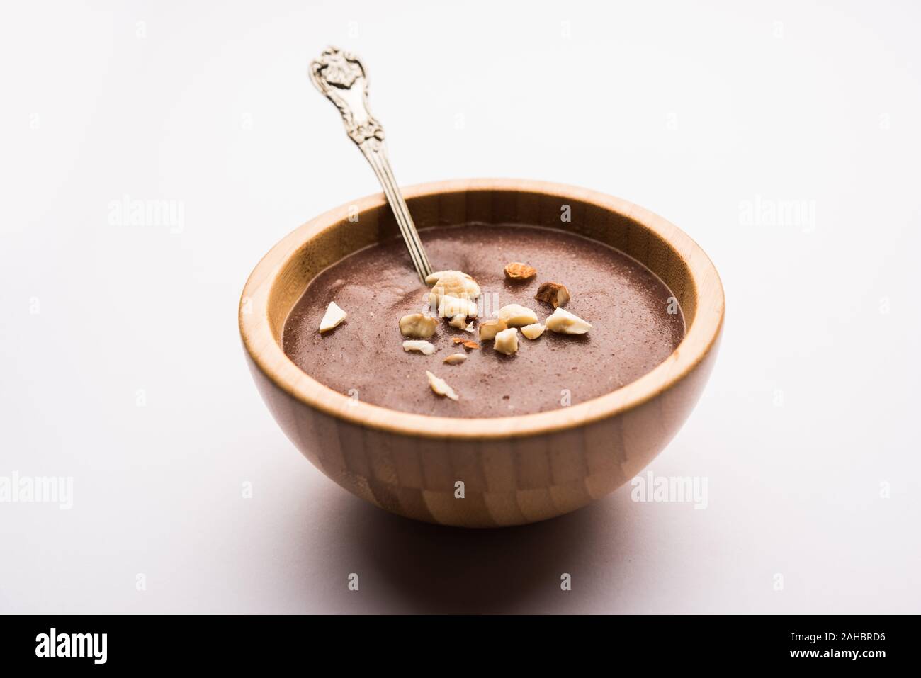 Sweet Ragi Malt / Healthy Ragi Porridge in a bowl garnished with ...