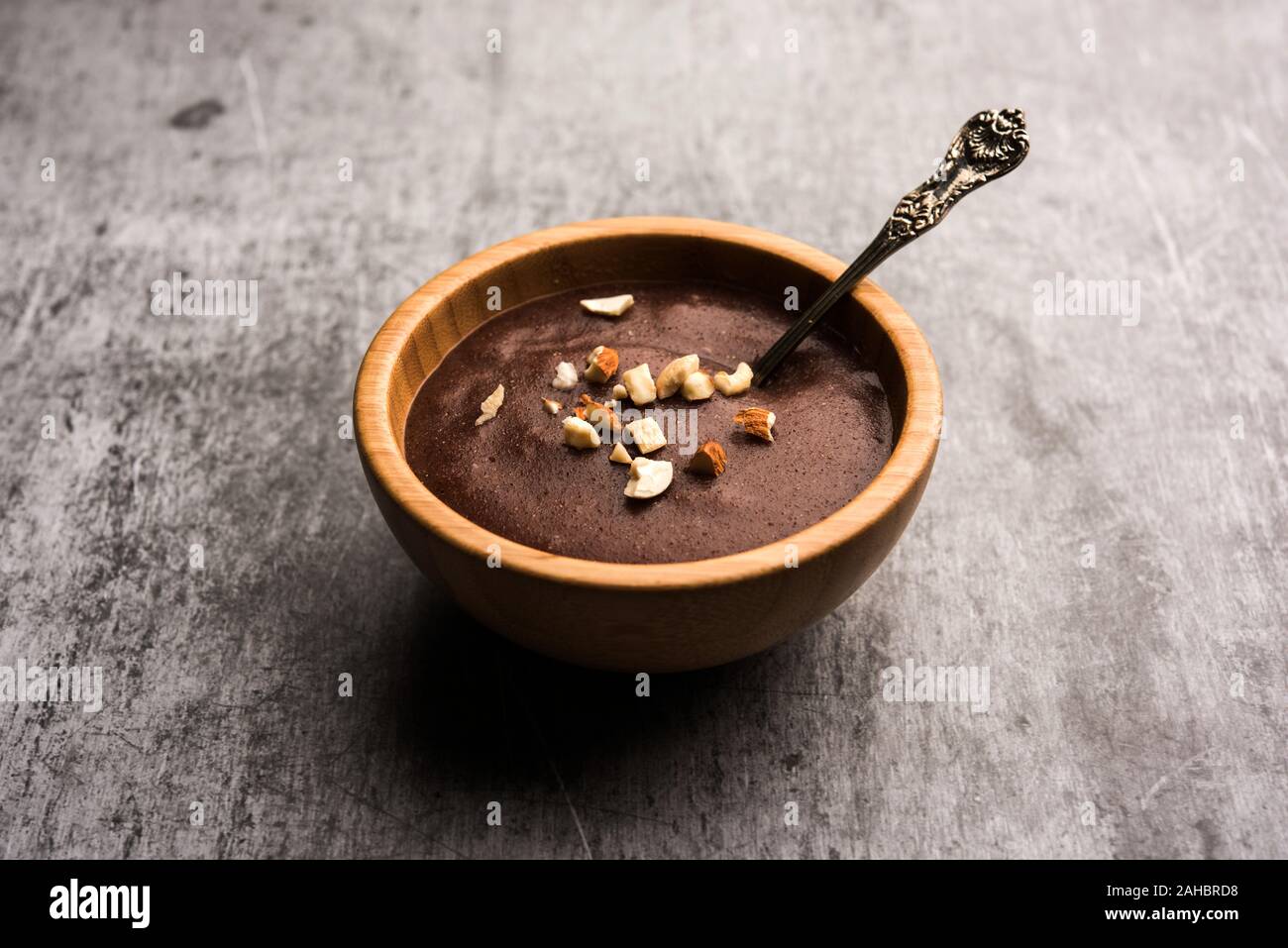 Sweet Ragi Malt / Healthy Ragi Porridge in a bowl garnished with ...