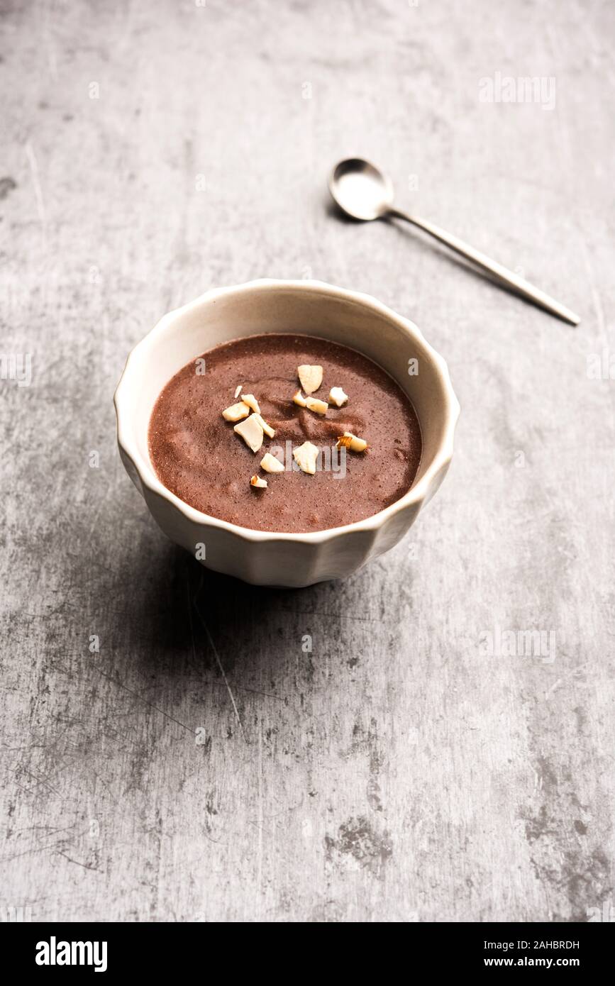 Sweet Ragi Malt / Healthy Ragi Porridge in a bowl garnished with ...