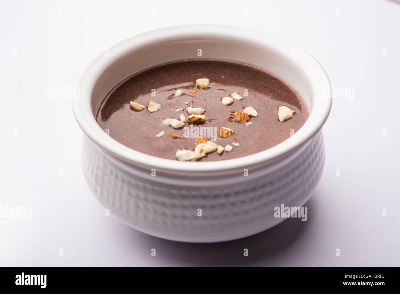 Sweet Ragi Malt / Healthy Ragi Porridge in a bowl garnished with ...