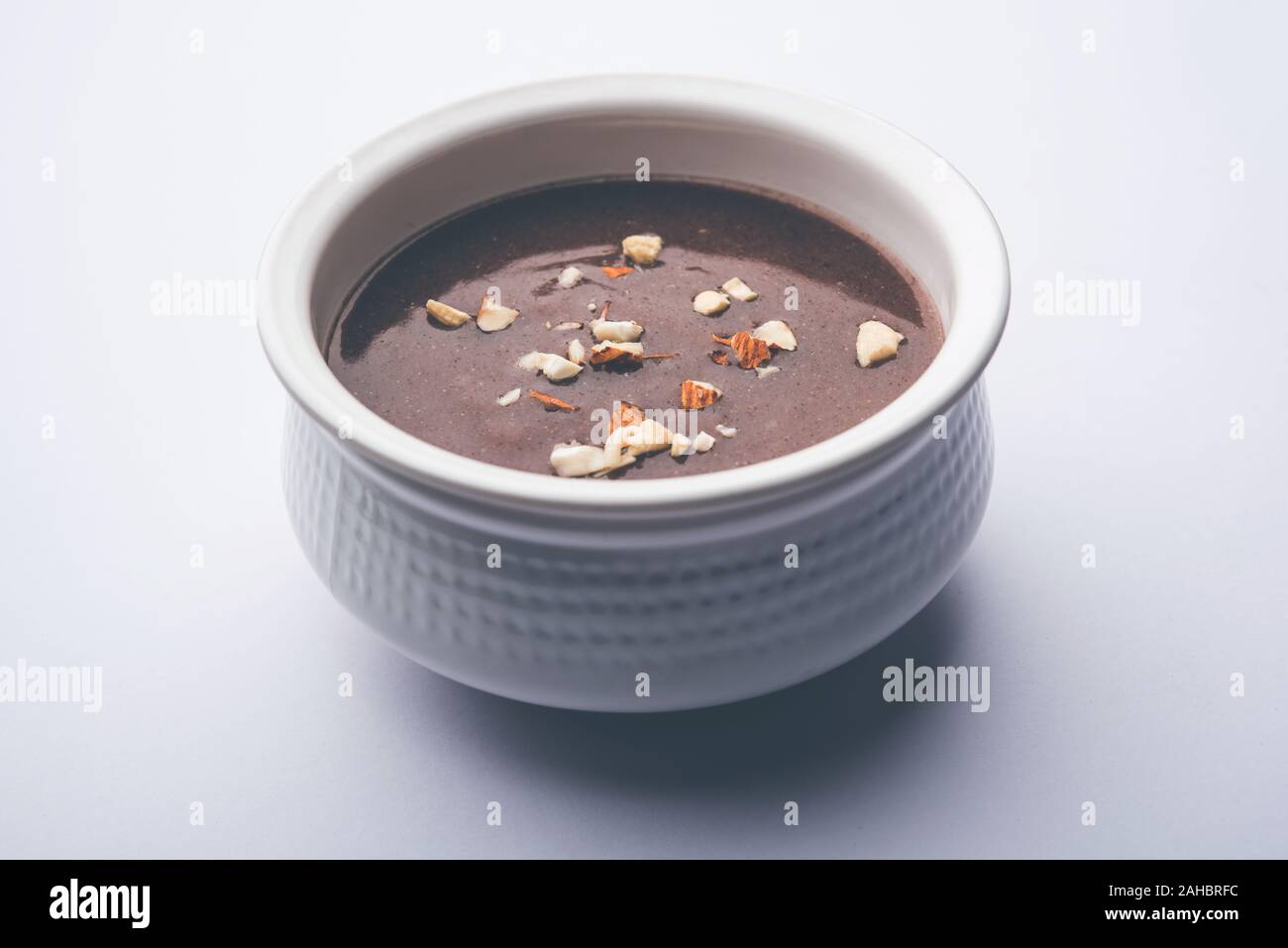 Sweet Ragi Malt / Healthy Ragi Porridge in a bowl garnished with ...