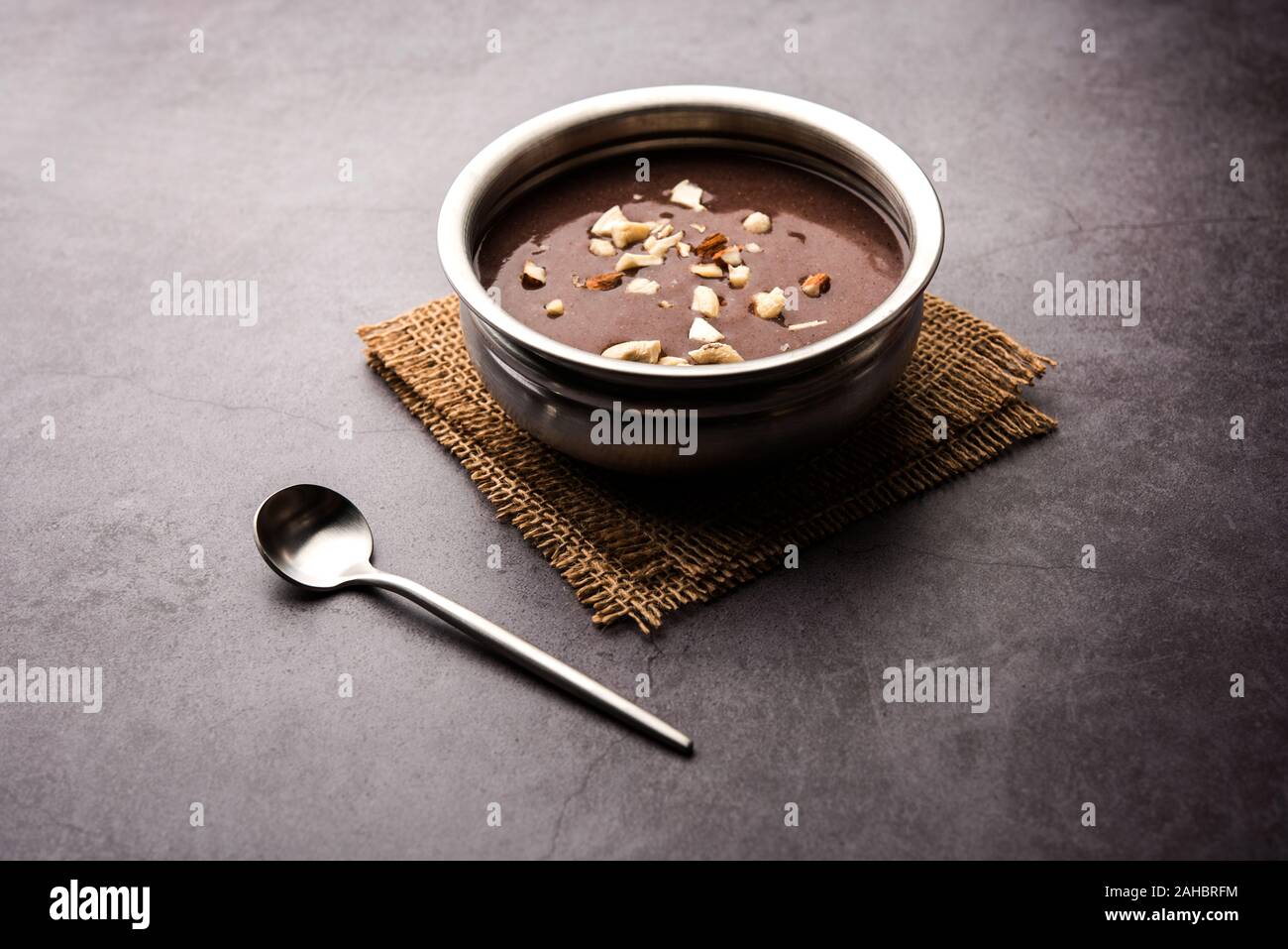 Sweet Ragi Malt / Healthy Ragi Porridge in a bowl garnished with ...