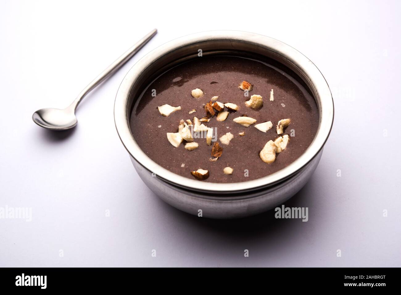 Sweet Ragi Malt / Healthy Ragi Porridge in a bowl garnished with ...