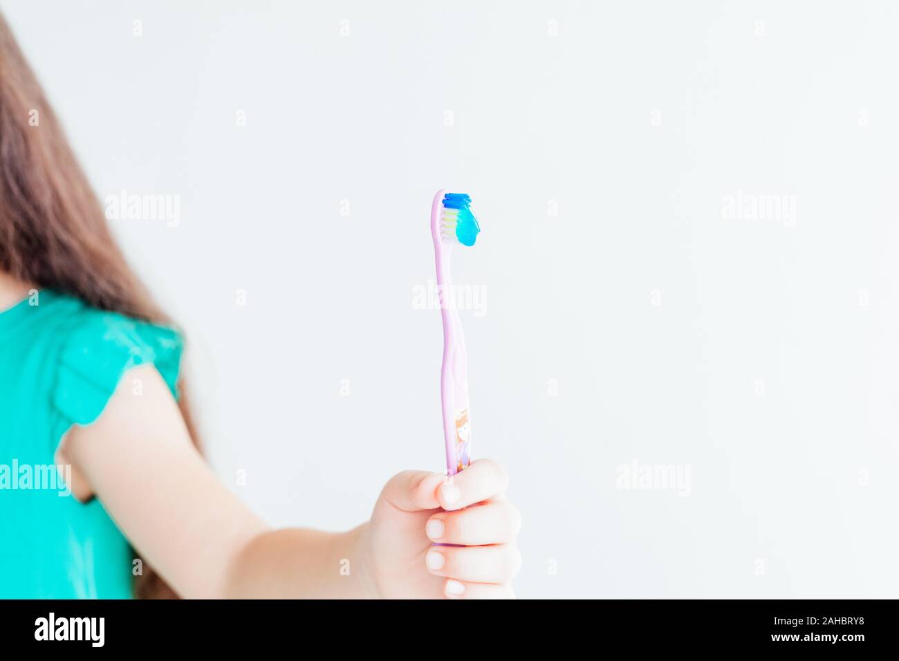 little girl with no teeth with a toothbrush in dentistry Stock Photo ...
