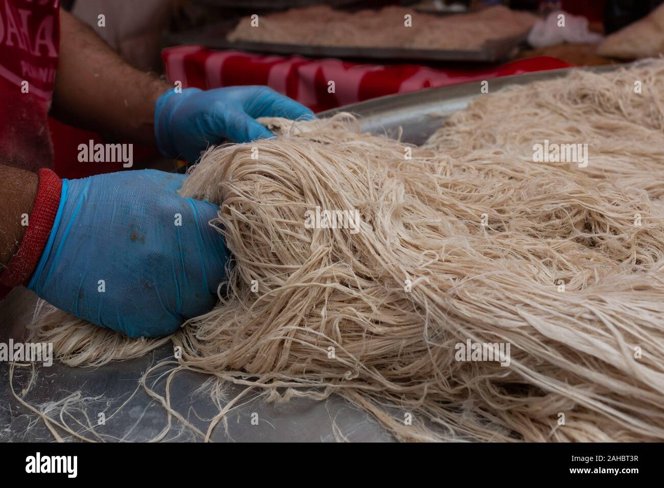 man pulling dough for pişmaniye, a traditional Turkish sweet Stock ...