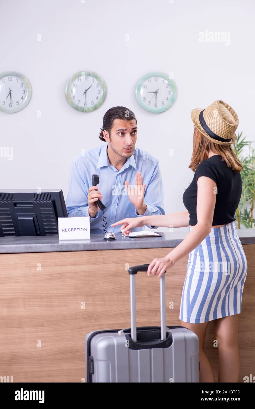 The young woman at hotel reception Stock Photo - Alamy