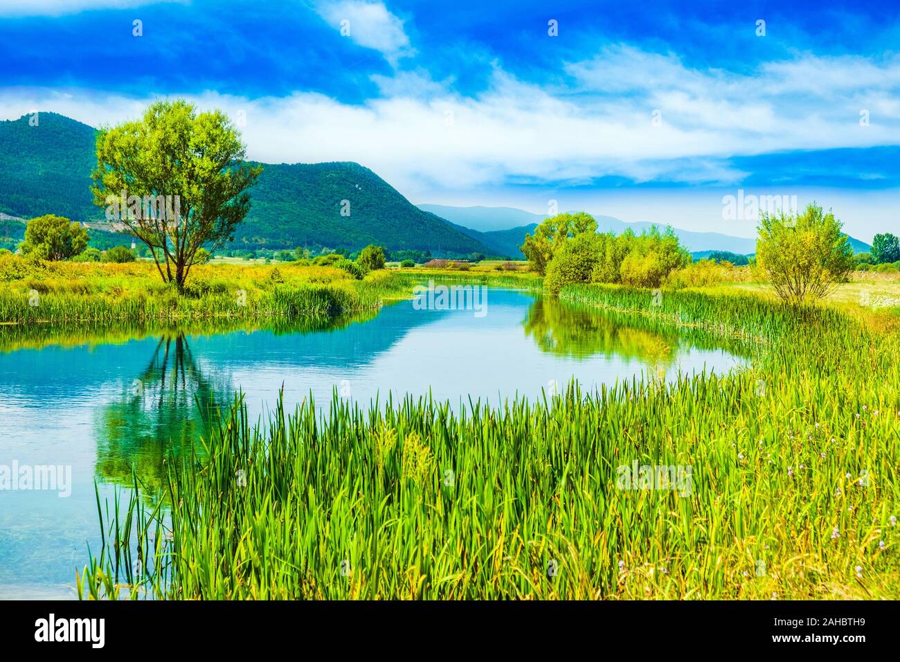 Croatia, beautiful scenic landscape, Gacka river among grass banks in ...
