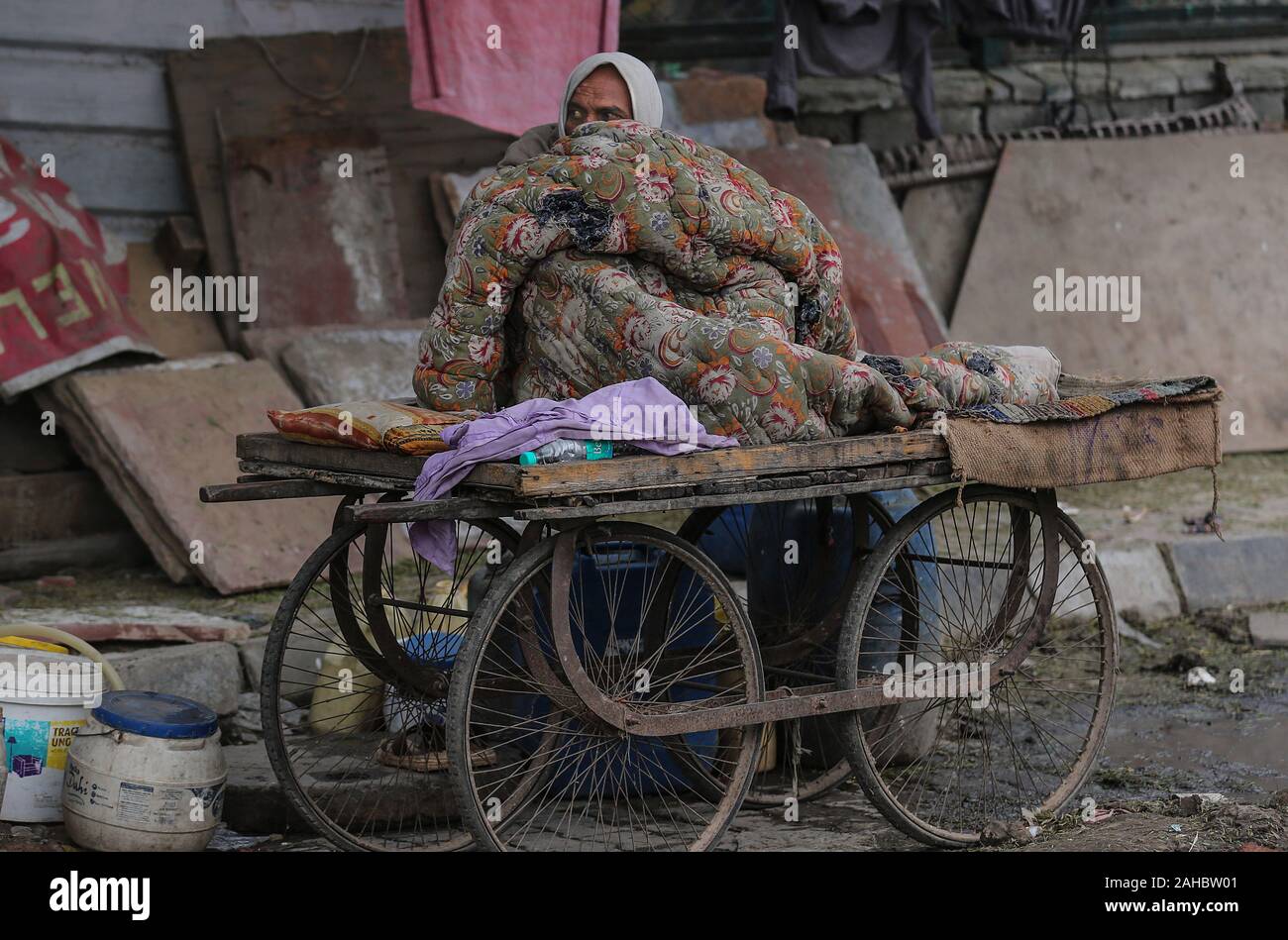 Cold man wraps himself in hi-res stock photography and images - Alamy