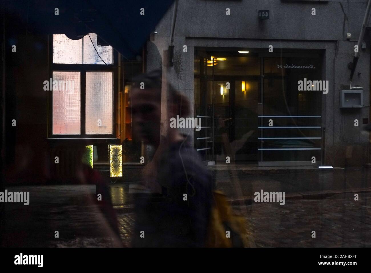 Eerie reflection of a man walking past a window Stock Photo - Alamy