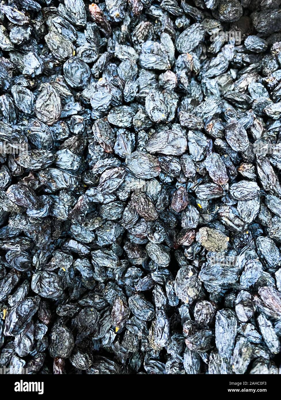 Blue raisins. Dried grapes. Background from raisins. Natural food Stock ...