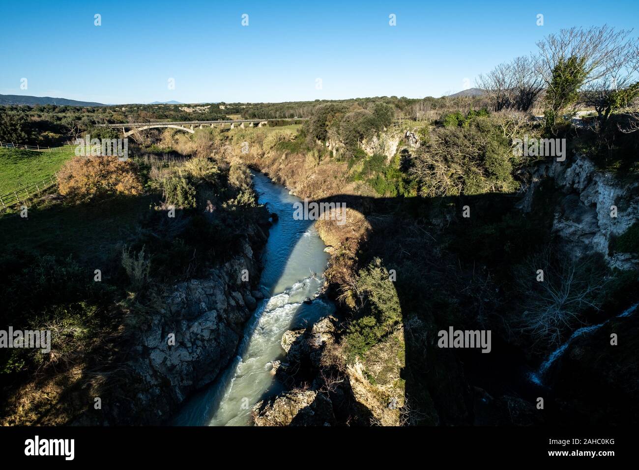 VULCI, ITALY - DECEMBER 26, 2019: shadow of the Badia bridge over the ...