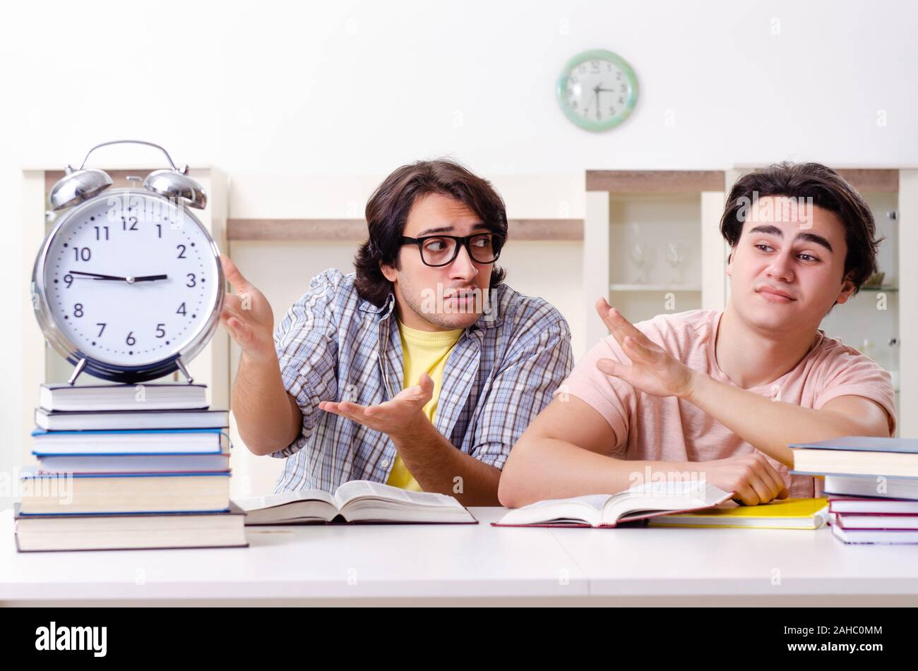 The two male students preparing for exams at home Stock Photo - Alamy