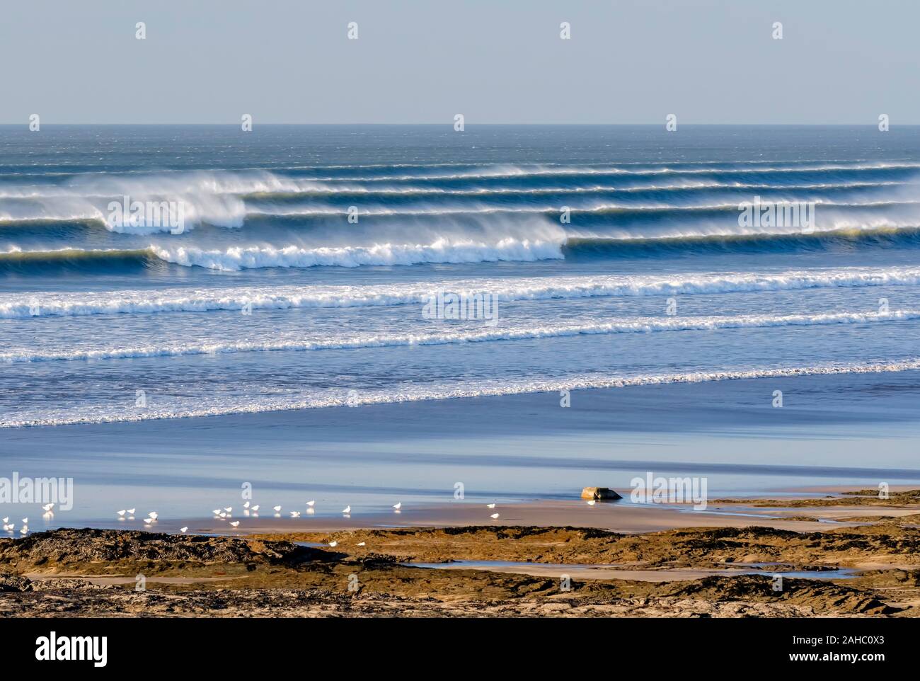 Summer days with blue skies, waves and surfers on Westward Ho! Beach ...