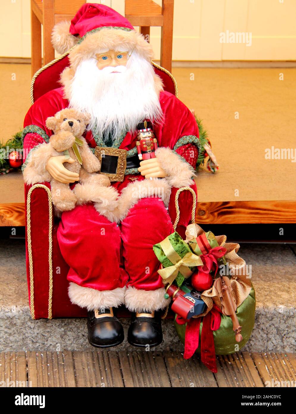 A Santa Claus Christmas Figure with Gifts and Toys Stock Photo - Alamy