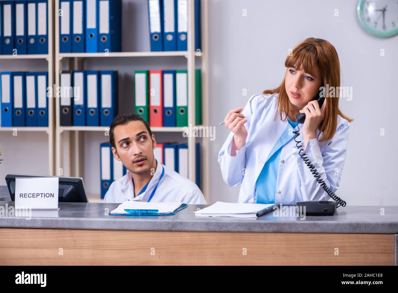 Two doctors working reception hi-res stock photography and images - Alamy