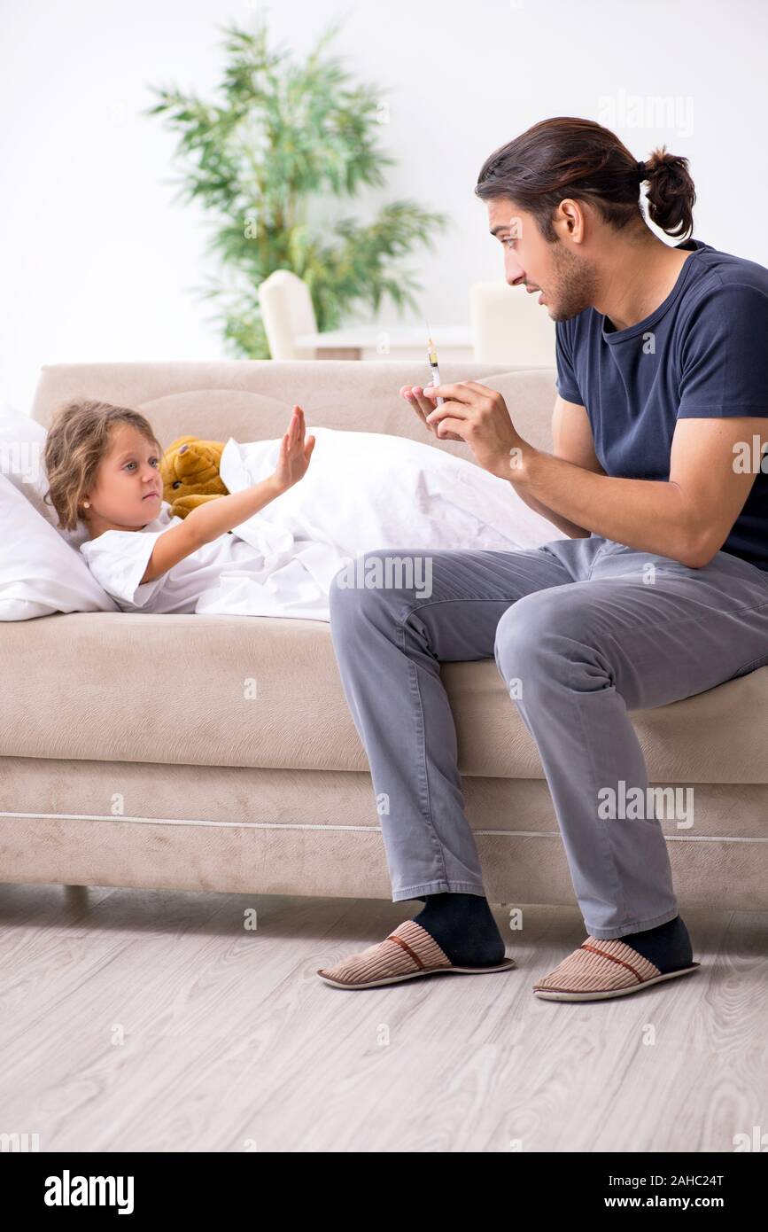 The father taking care of his ill daughter Stock Photo - Alamy
