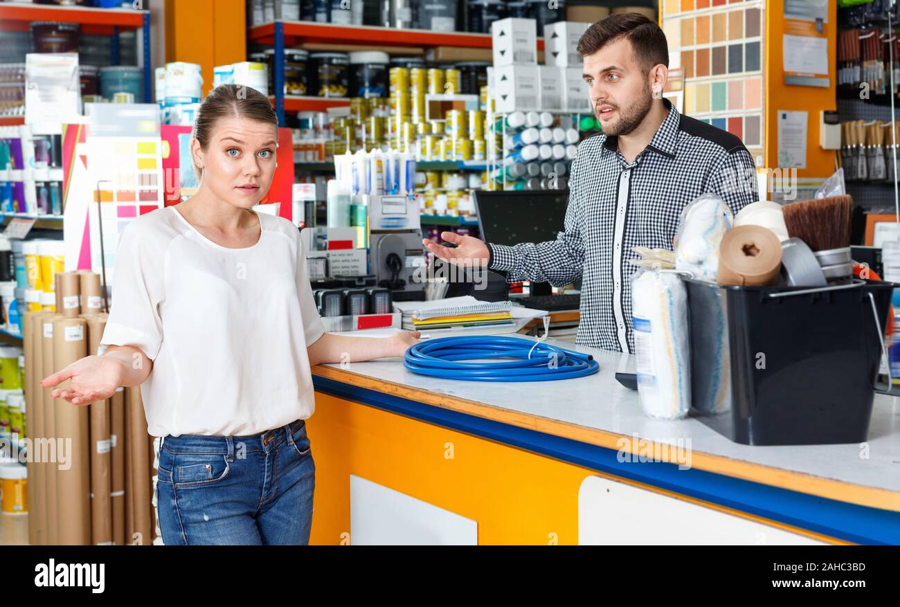 Unhappy customer in counter hi-res stock photography and images - Alamy