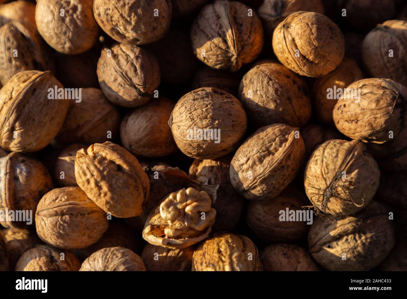 unshelled walnuts for sale in the market Stock Photo - Alamy