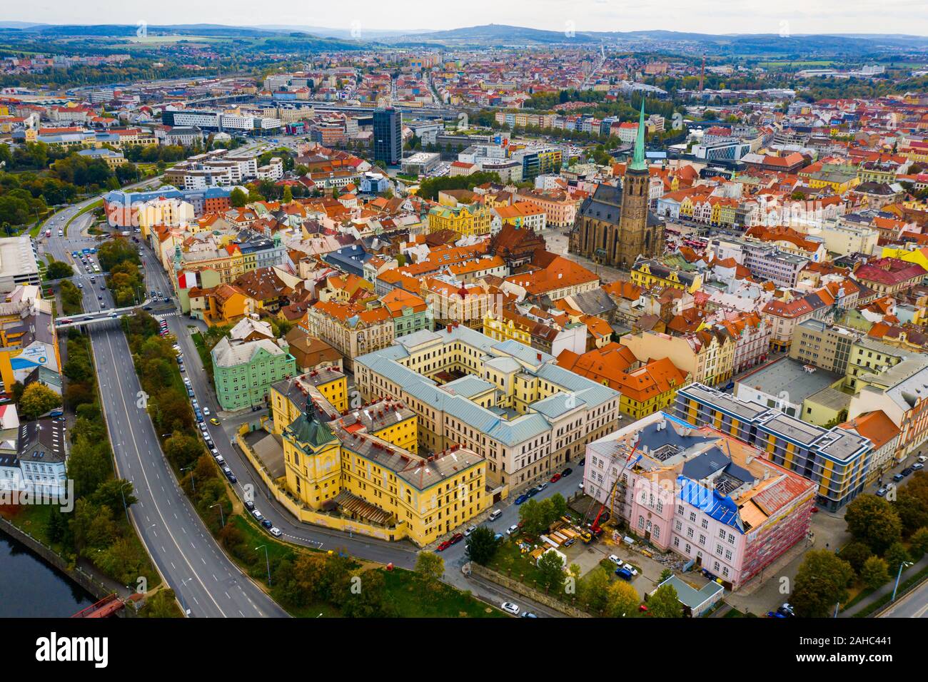 Picturesque aerial view of old buildings of Pilsen cityscape with river ...