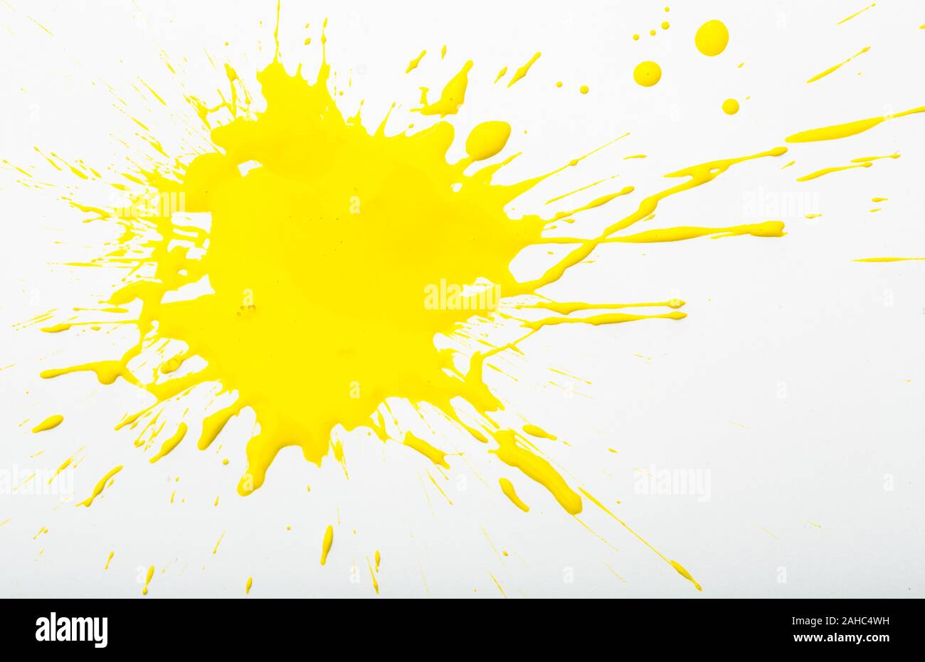 Blot and splashes of yellow paint isolated on white background Stock ...