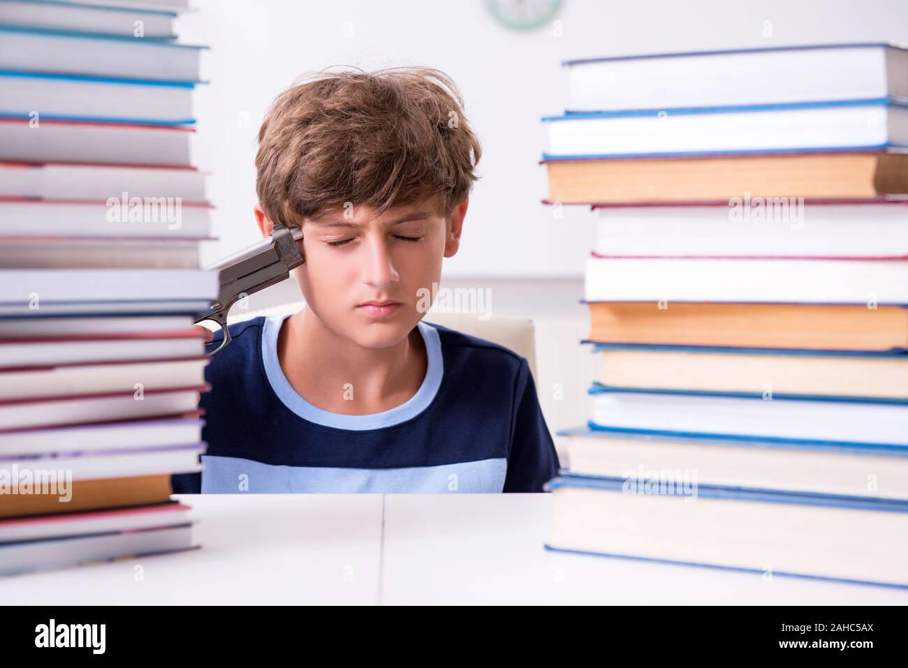 The young student stressed due to excessive studies Stock Photo - Alamy