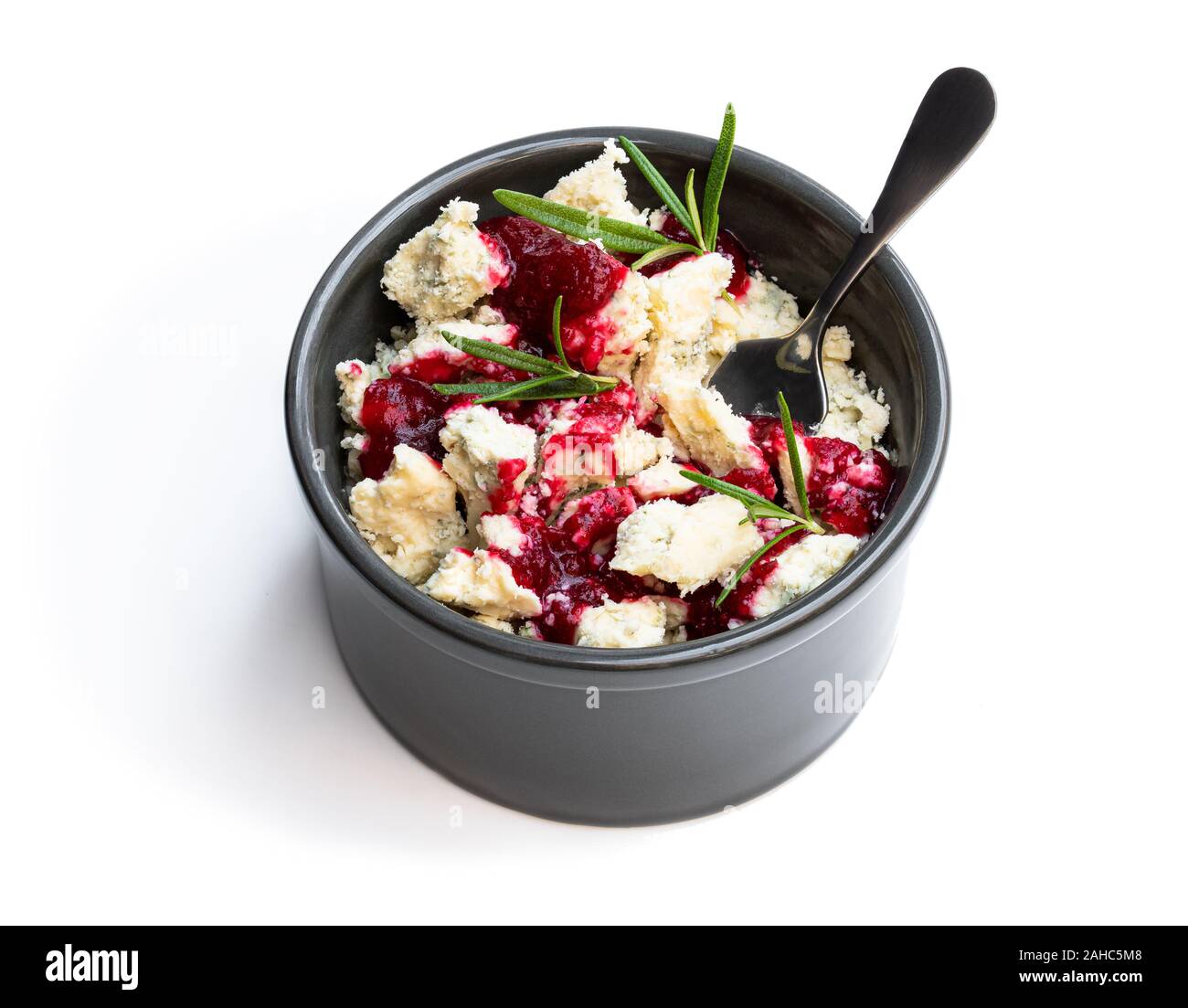 Potted aged Blue stilton cheese with cranberry sauce isolated on white ...