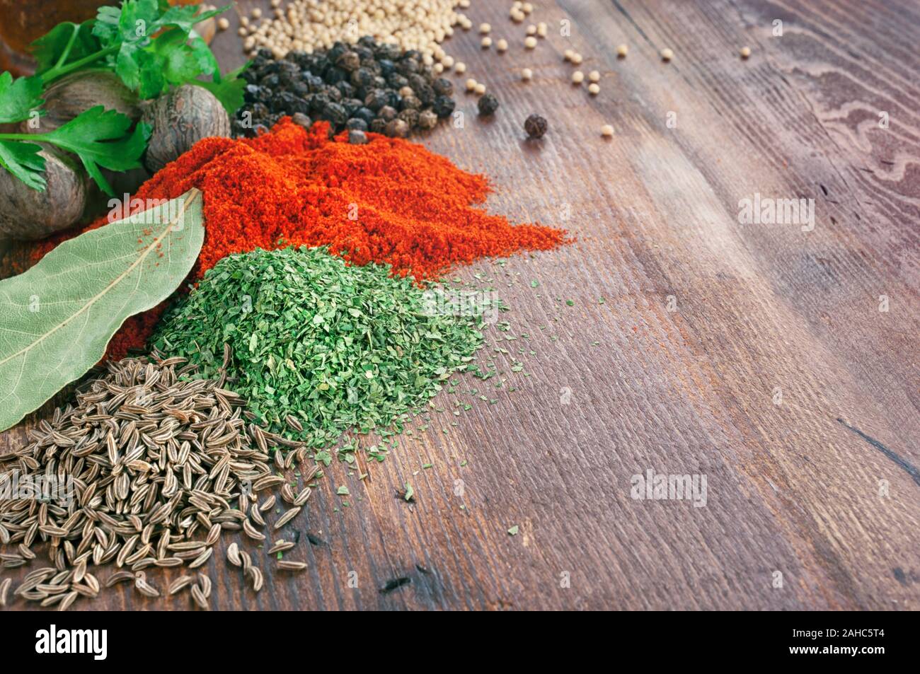 Cumin and spices on rustic wood background hi-res stock photography and ...