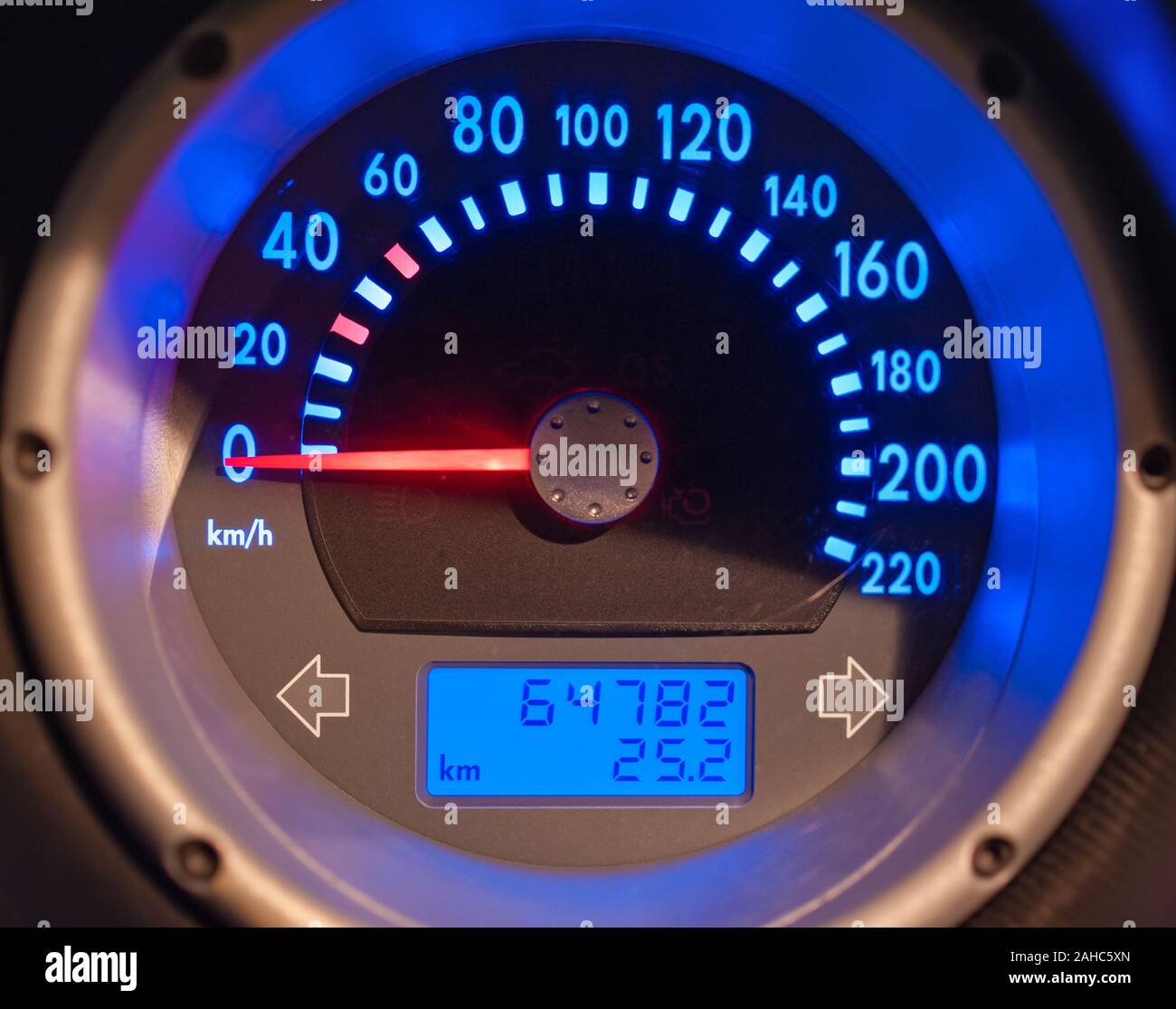 Car illuminated speedometer odometer closeup Stock Photo - Alamy