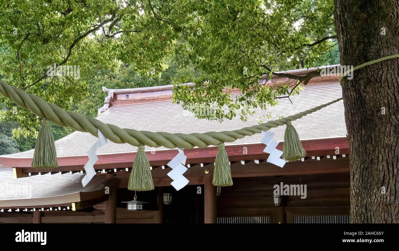 rope between two trees at meiji shrine in tokyo Stock Photo - Alamy