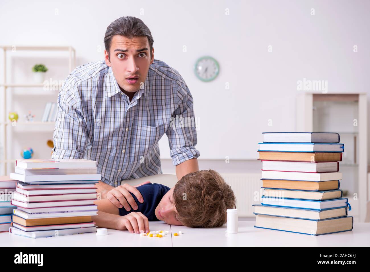 The young student stressed due to excessive studies Stock Photo - Alamy