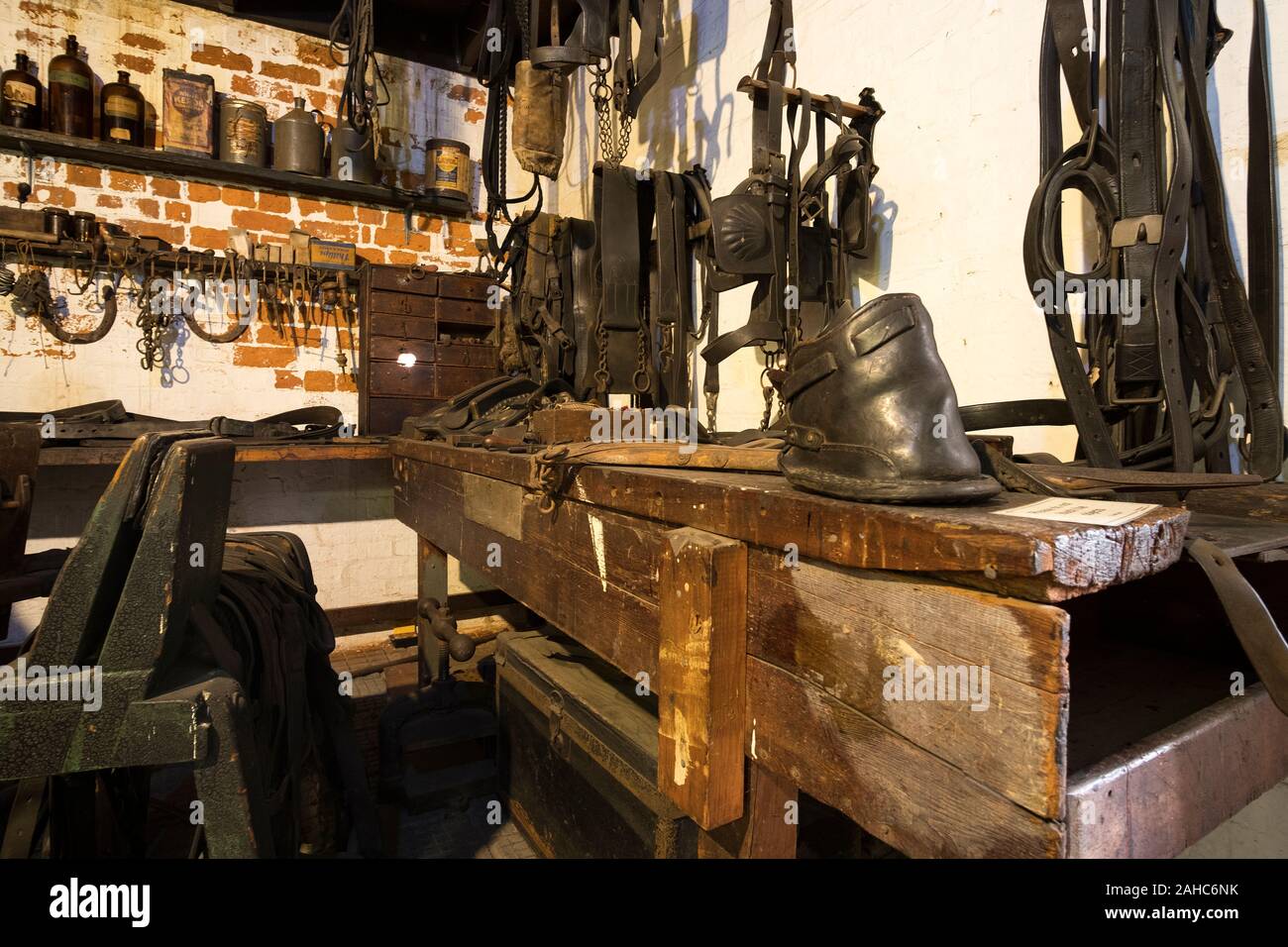 Old vintage saddle makers work bench and tools preserved in a museum ...