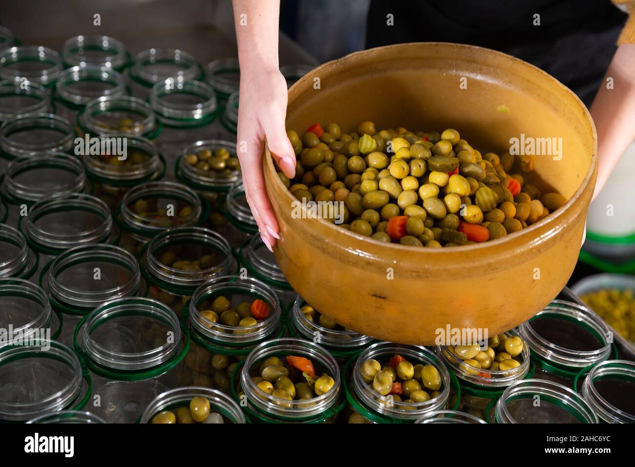 Preparing for pickling olives at food factory Stock Photo - Alamy