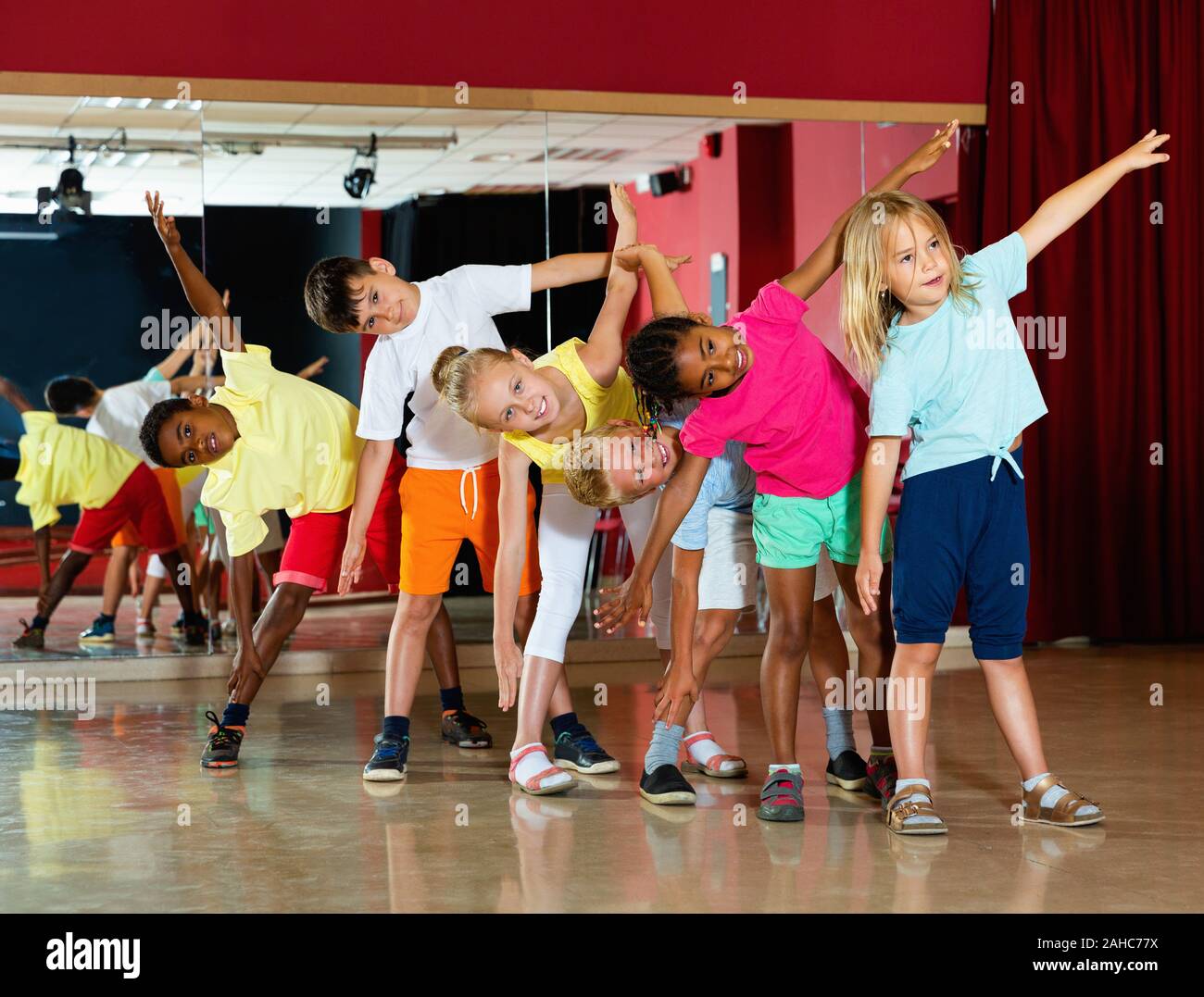 Happy emotional positive smiling children posing at modern dance class ...