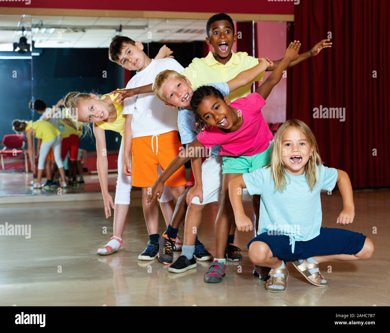 Happy emotional smiling children posing at modern dance class Stock ...