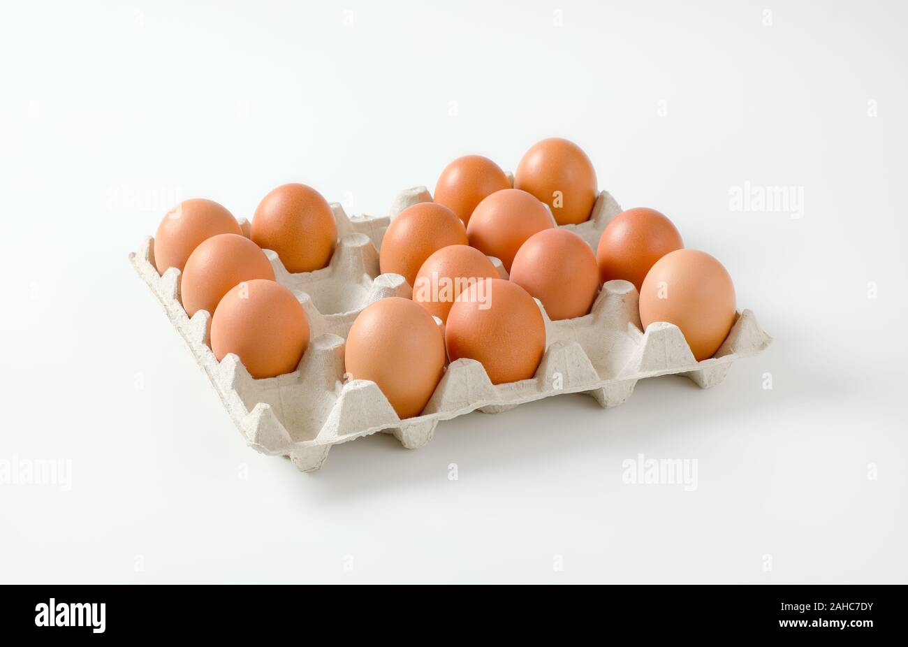 Fresh brown eggs in a twenty dimpled egg tray Stock Photo - Alamy