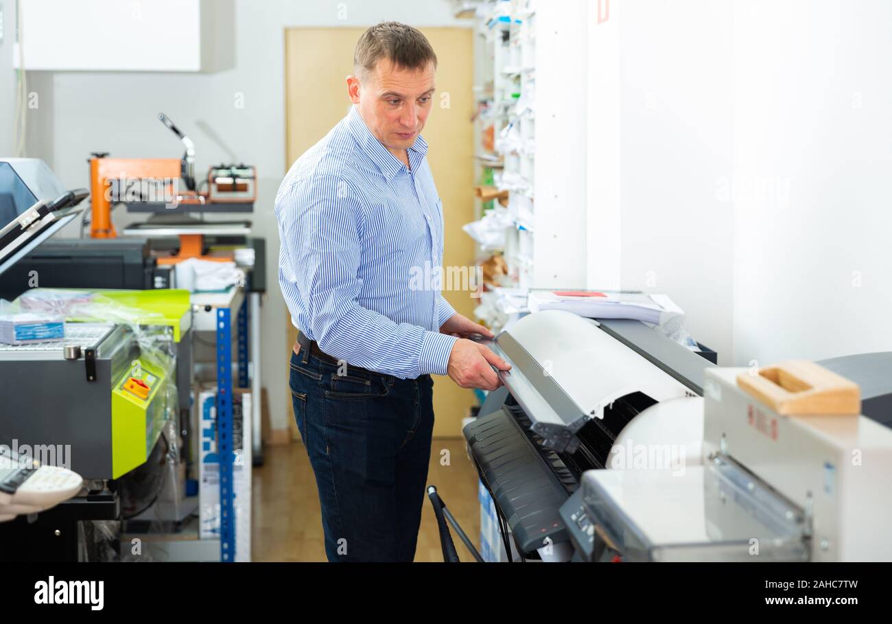 Plotter printing wide format large banner hi-res stock photography and ...