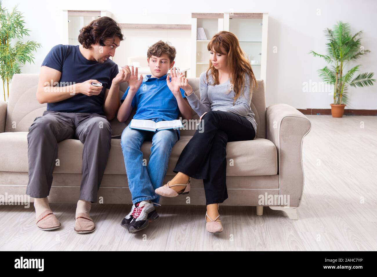The concept of underage smoking with young boy and family Stock Photo ...