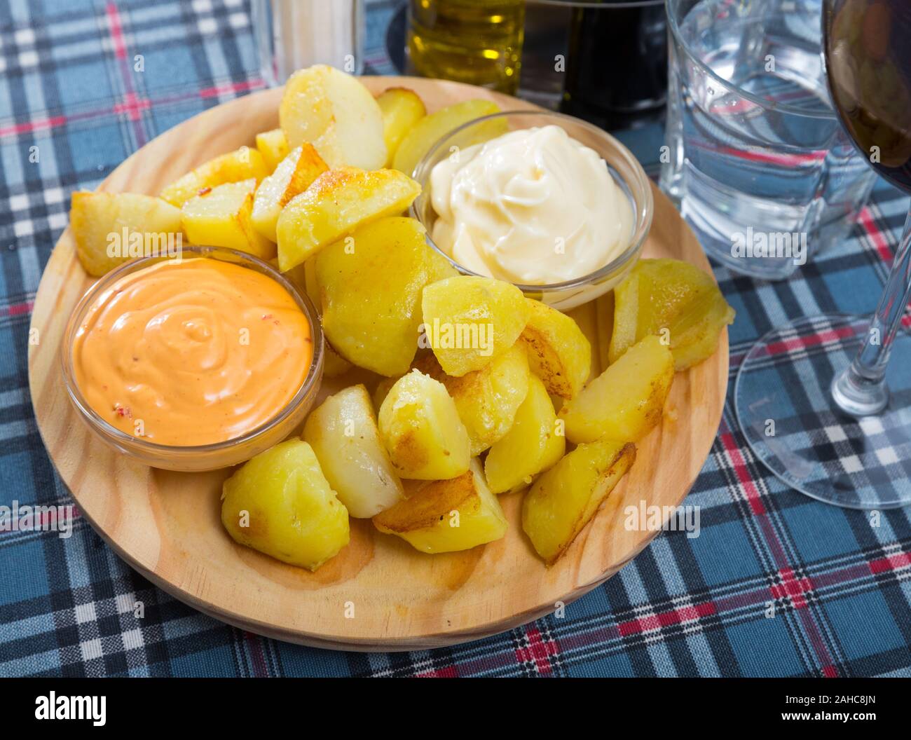 Delicious Patatas Bravas – traditional Spanish potato snack Stock Photo ...