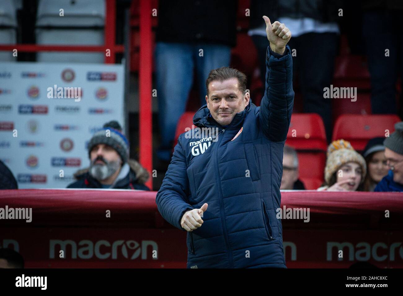 Football coach Graham Westley standing pitch side during match whilst ...