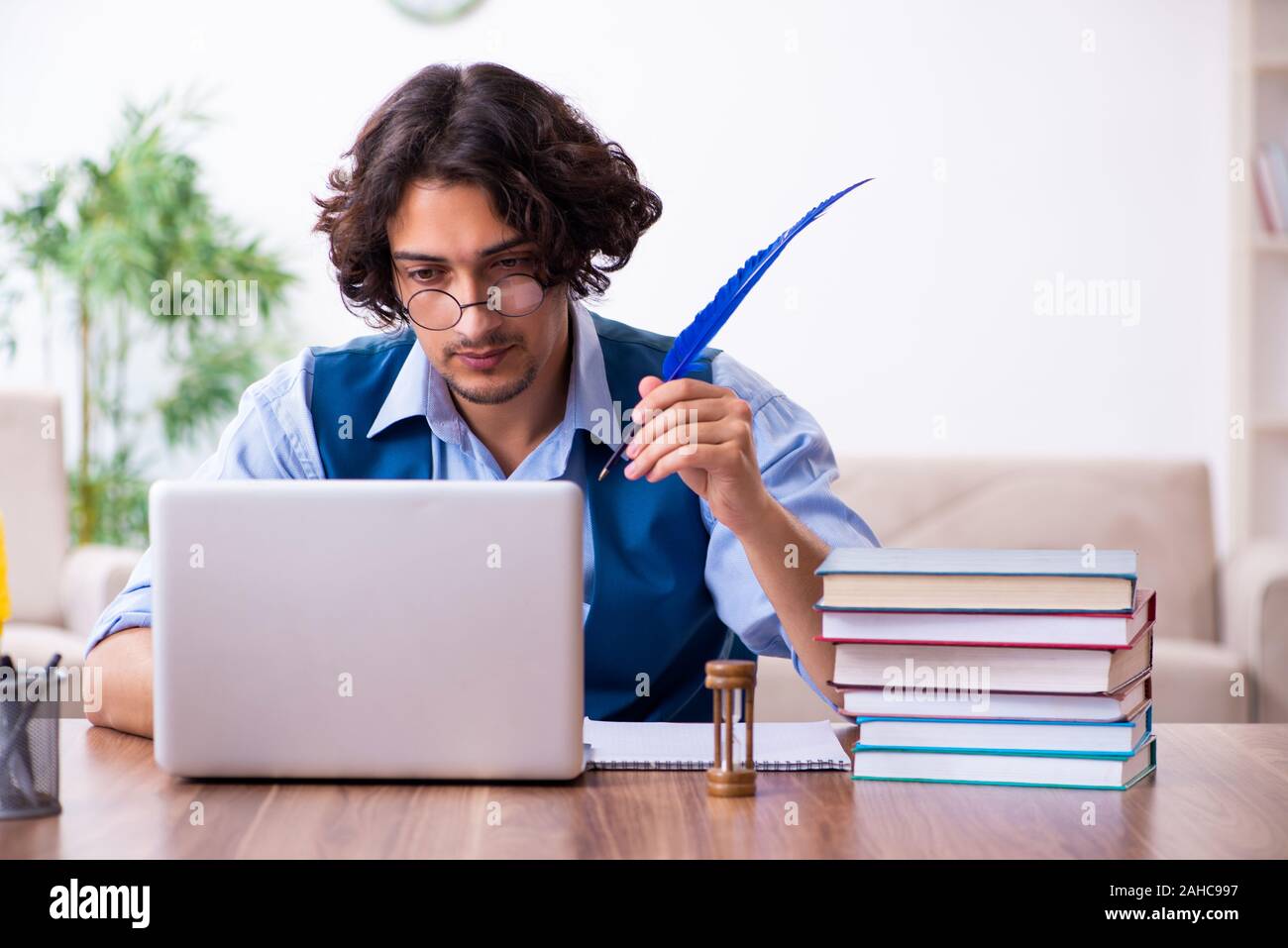 The young writer working on his new work Stock Photo - Alamy