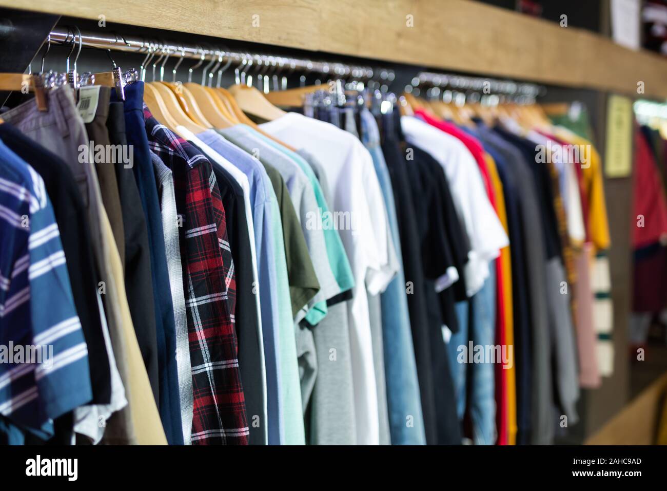 Different fashion clothes in the modern shopping centre Stock Photo - Alamy