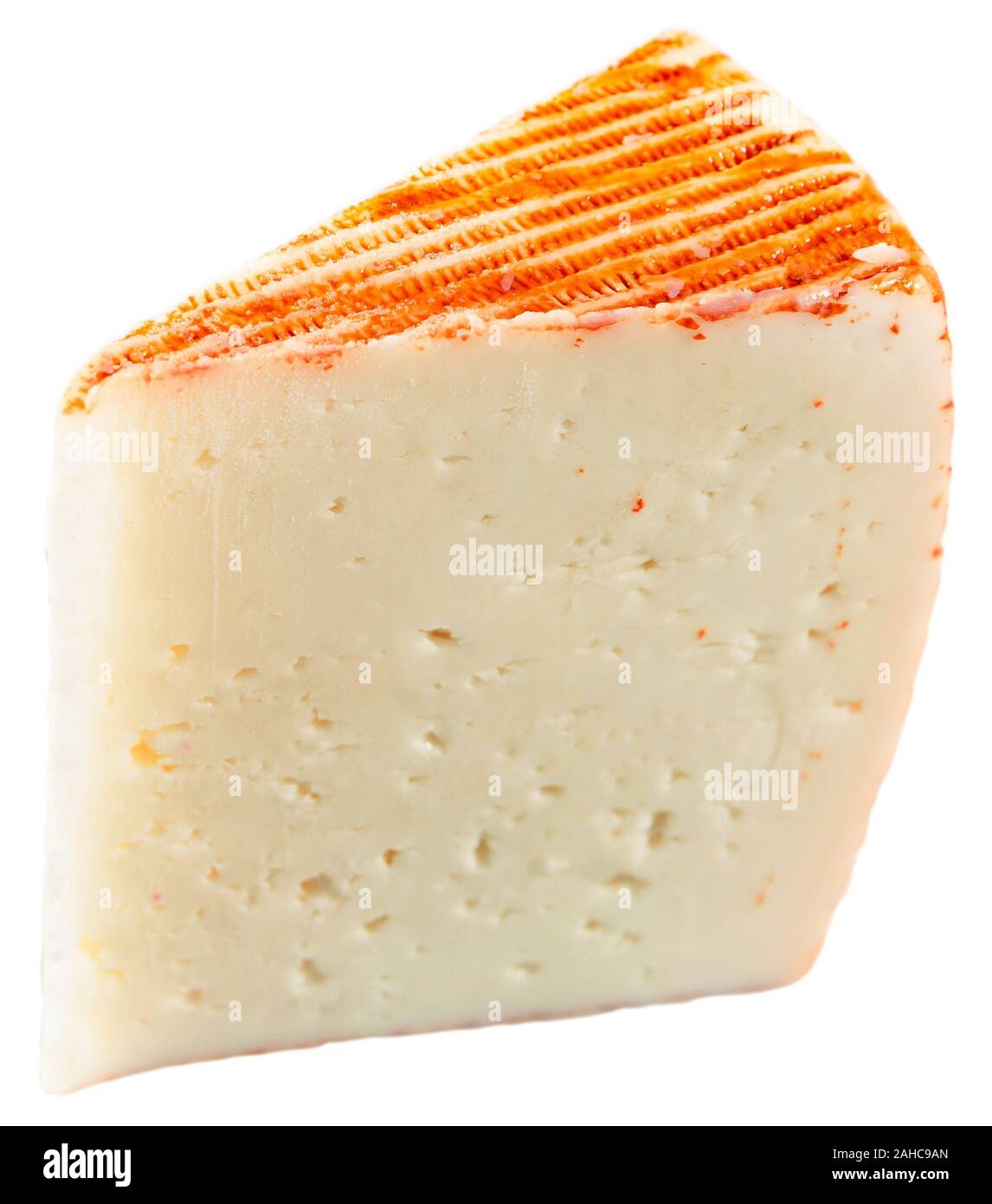 Appetizing slice of semi-soft cheese. Isolated over white background ...
